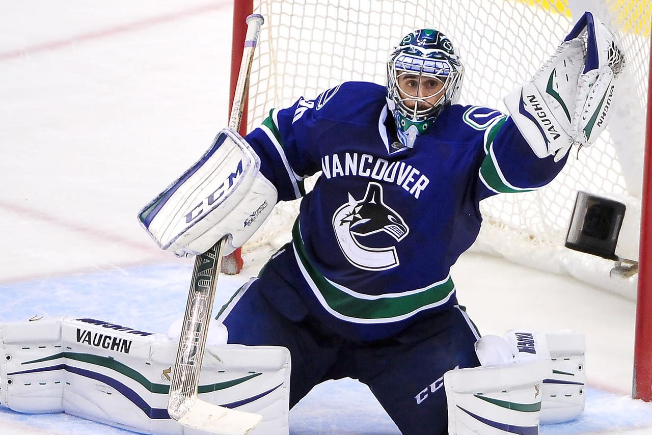 Canucks' Ryan Miller posts 300th career win, keeps Hurricanes winless ...