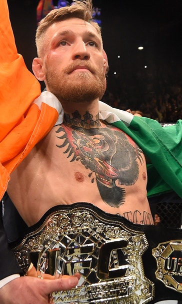 Conor McGregor makes history winning 2nd UFC title after knocking out ...