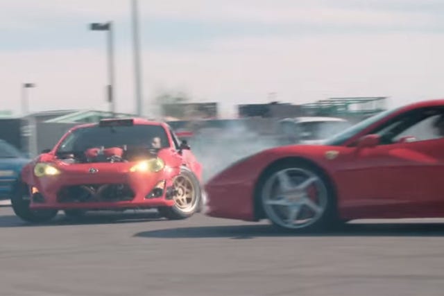 Watch this Ferrari-powered Toyota do donuts around a 458 | FOX Sports