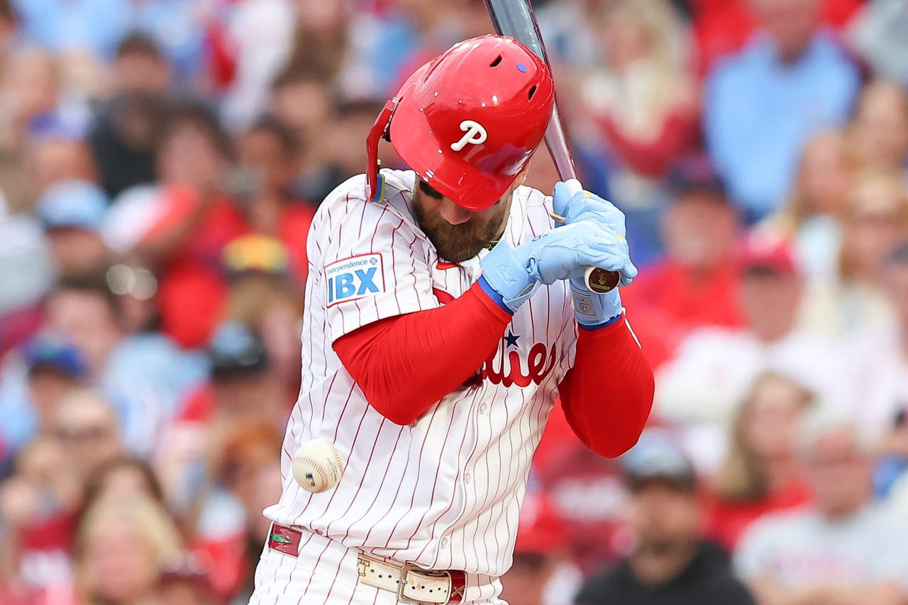 Phillies' Bryce Harper leaves game with bruised elbow when hit by pitch ...